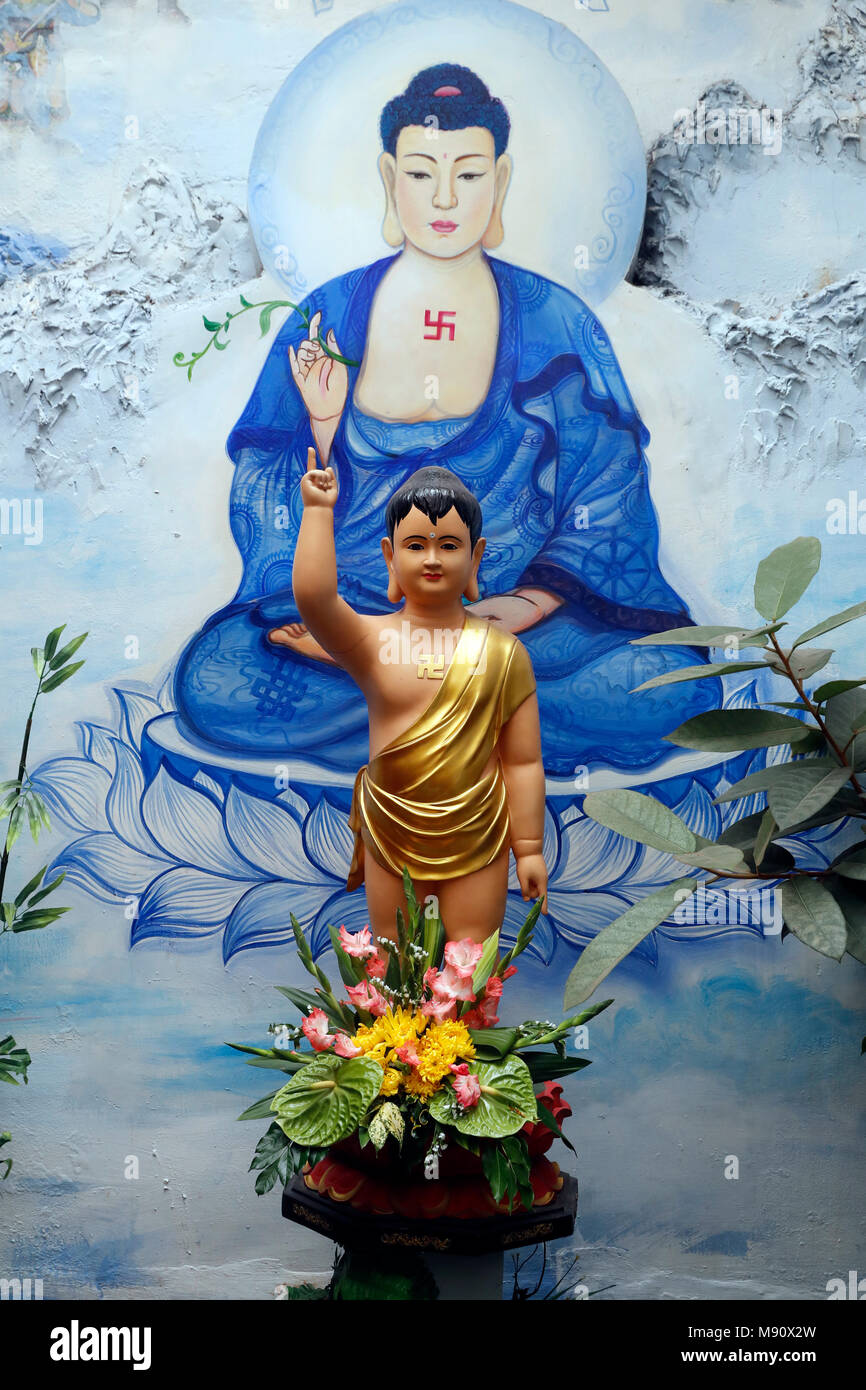 Buddhist statue with child hi-res stock photography and images - Alamy