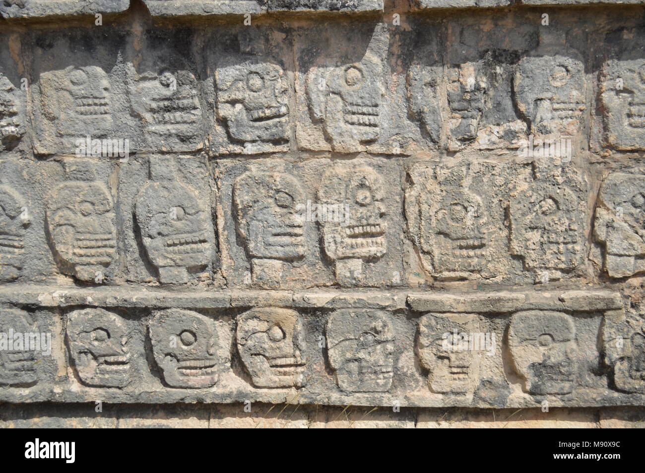Skull carvings of the skull platform at Chichen Itza, Mexico Stock ...