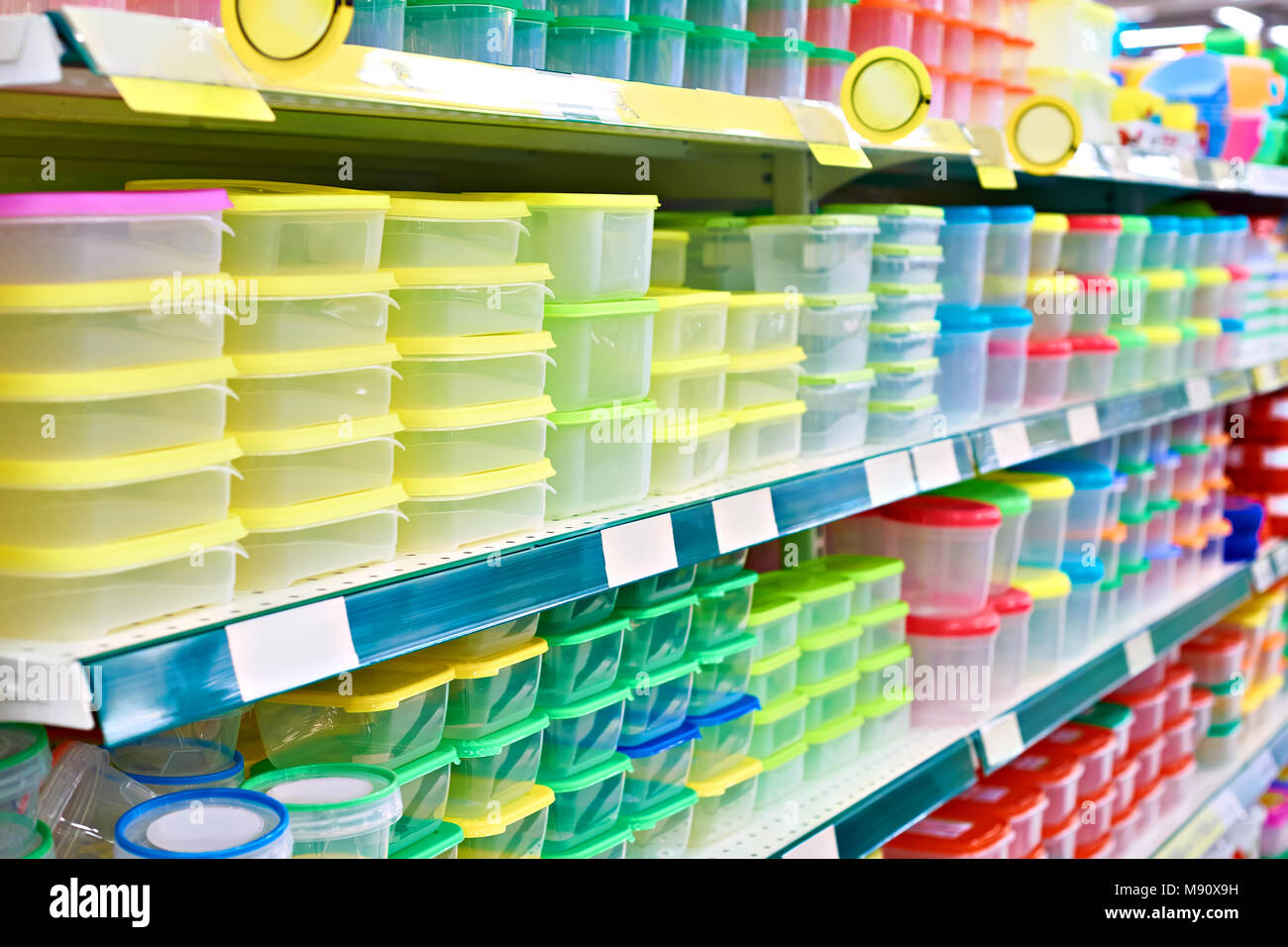 Plastic food containers on the shelf in the store Stock Photo - Alamy