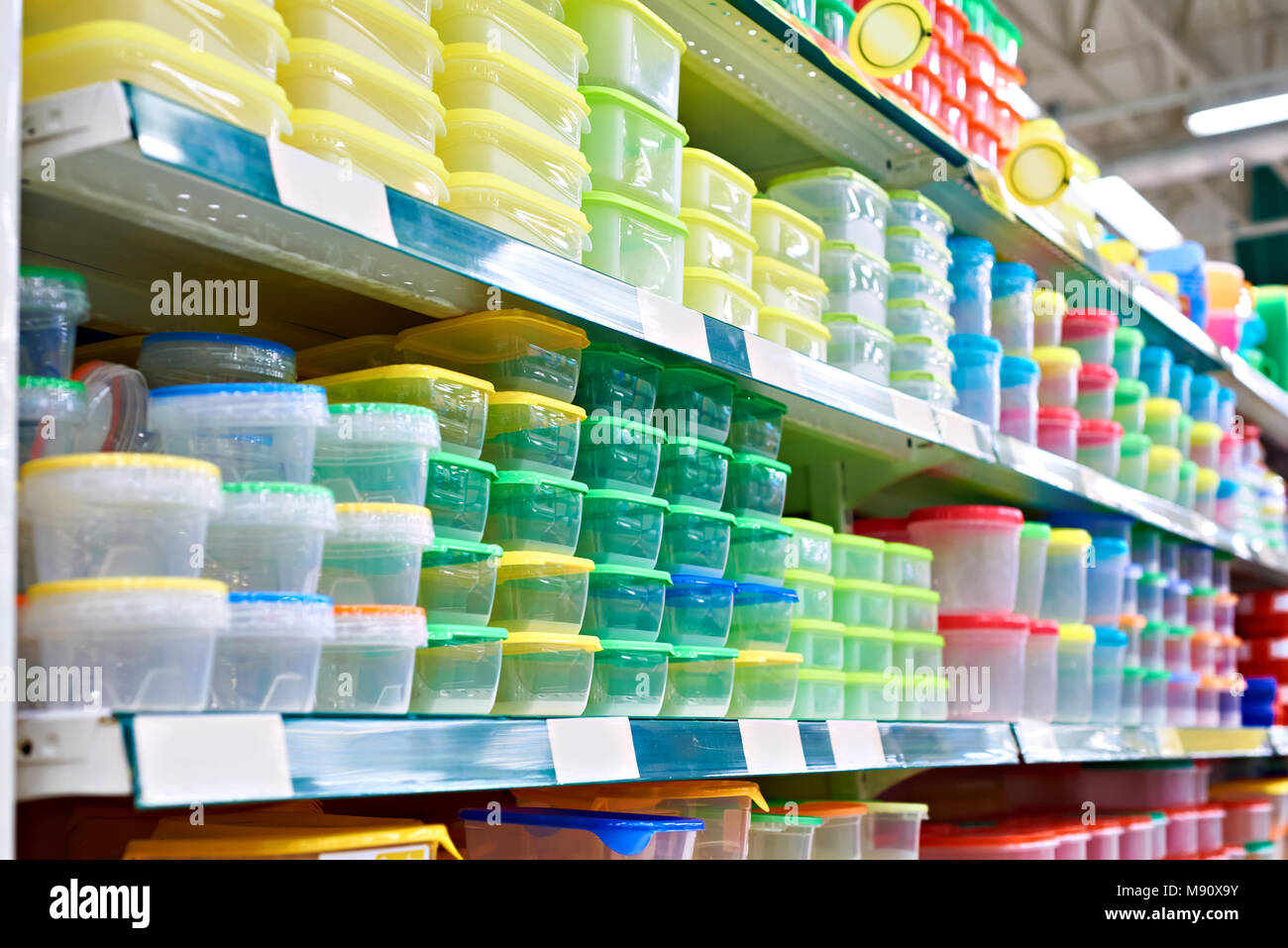 Plastic food containers on the shelf in the store Stock Photo - Alamy