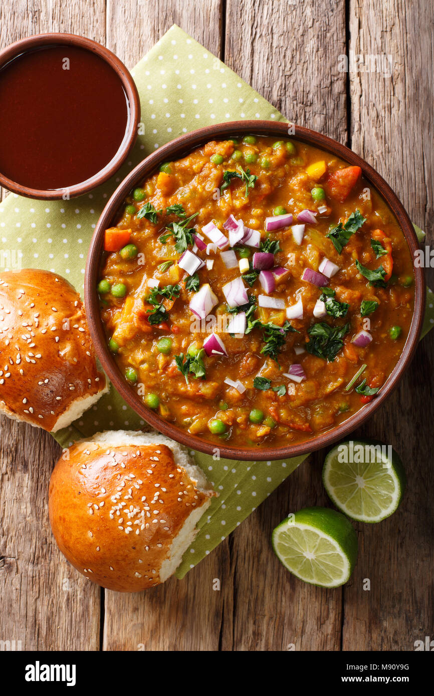 Pav Bhaji Indian spicy fast food with bread Paav close-up in a bowl on ...