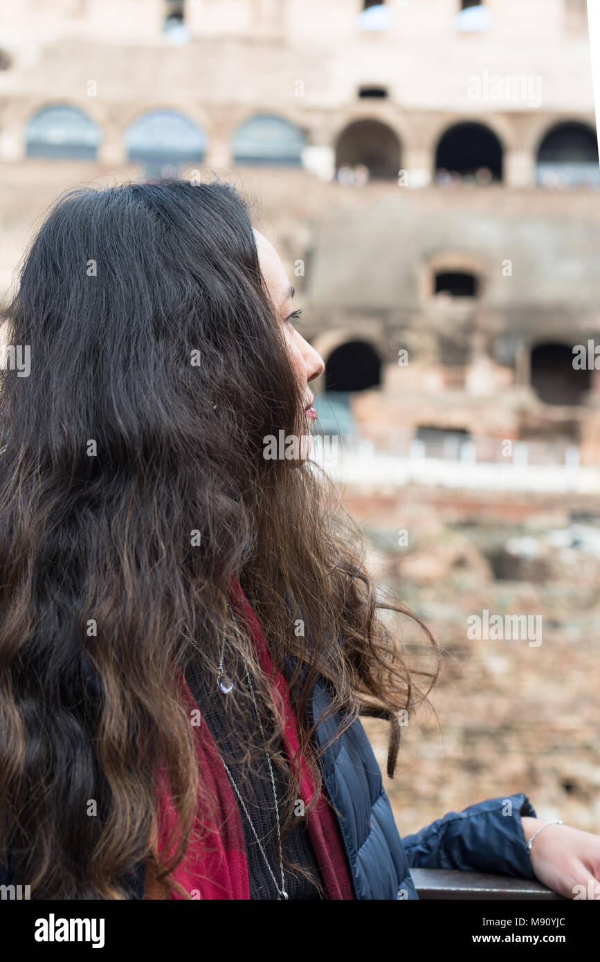 Vertical picture of black hair woman looking inside of Coliseum ...