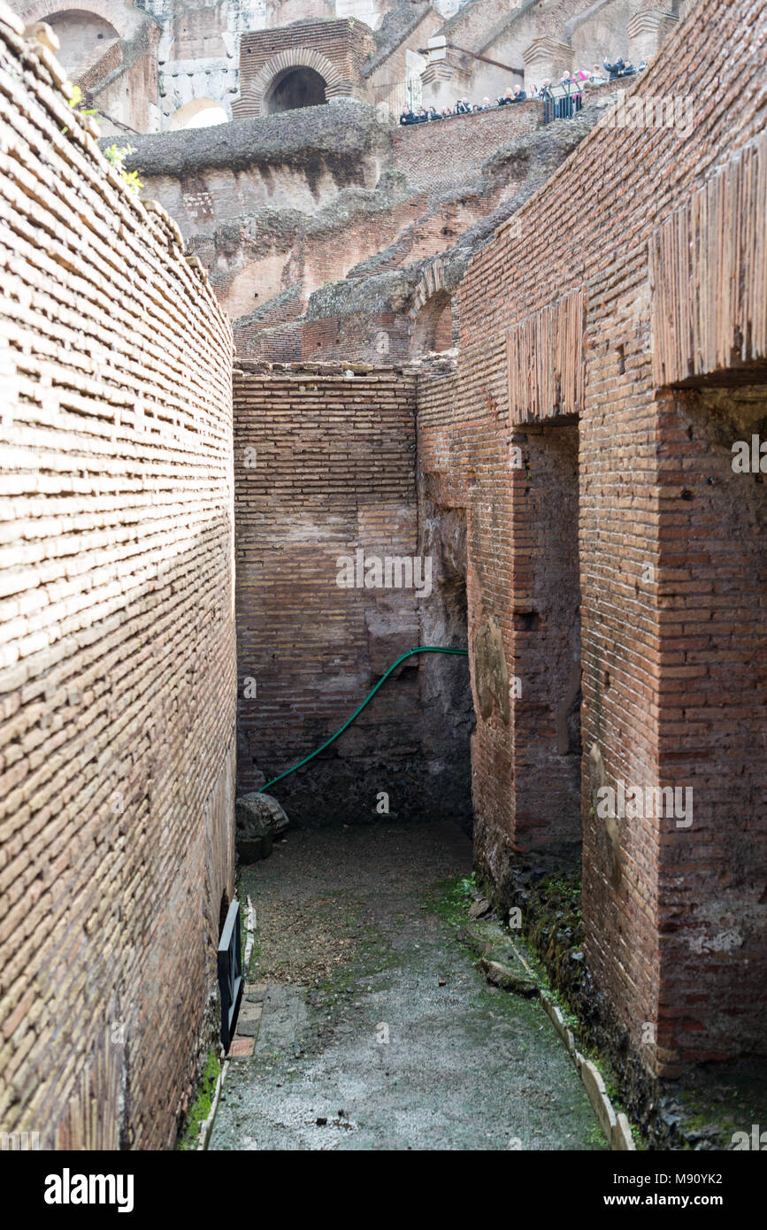 Vertical picture inside of brick wall inside Coliseum, located in Rome ...