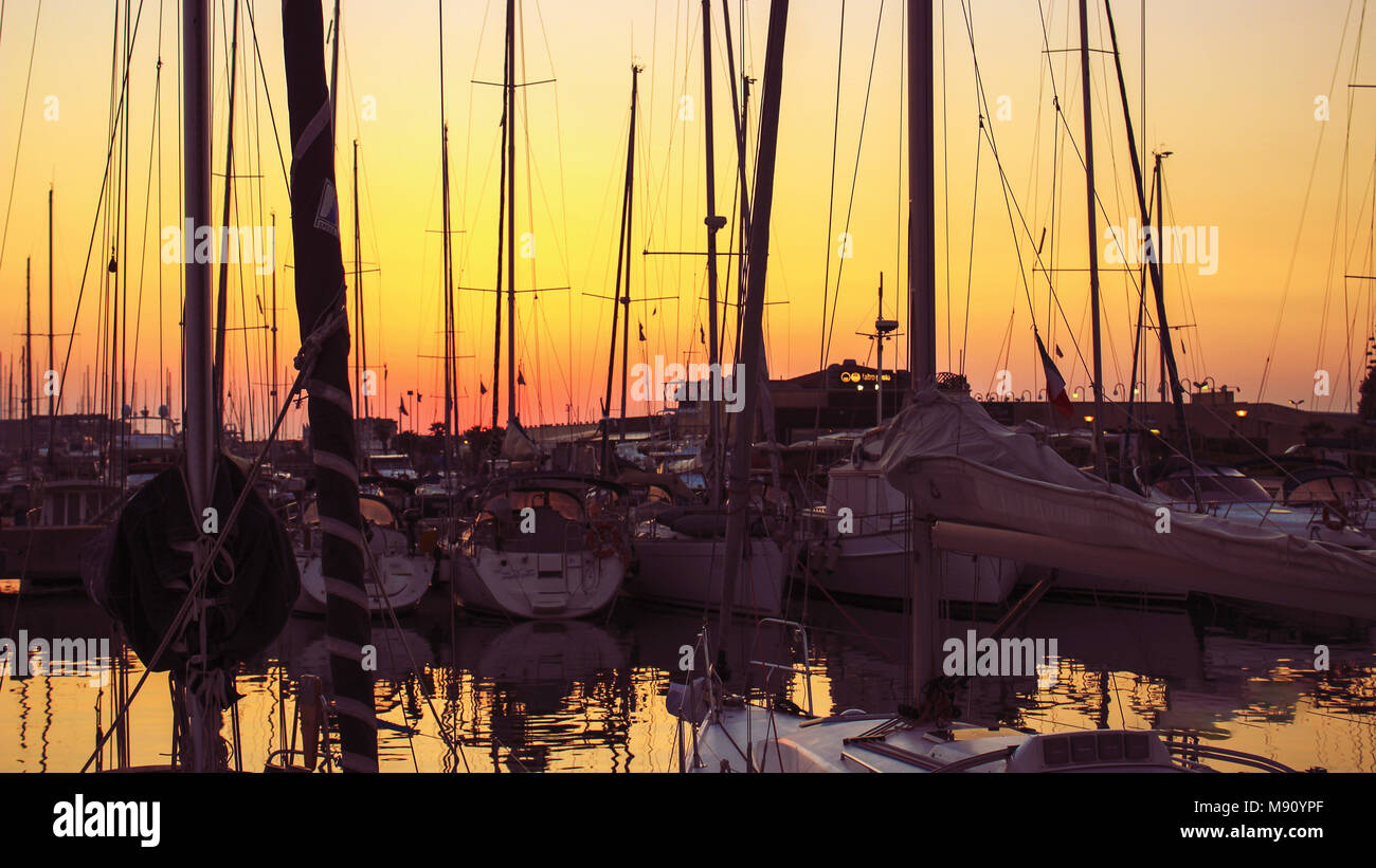 Warm and colourful Sunset at Rome`s turistic harbour Stock Photo - Alamy