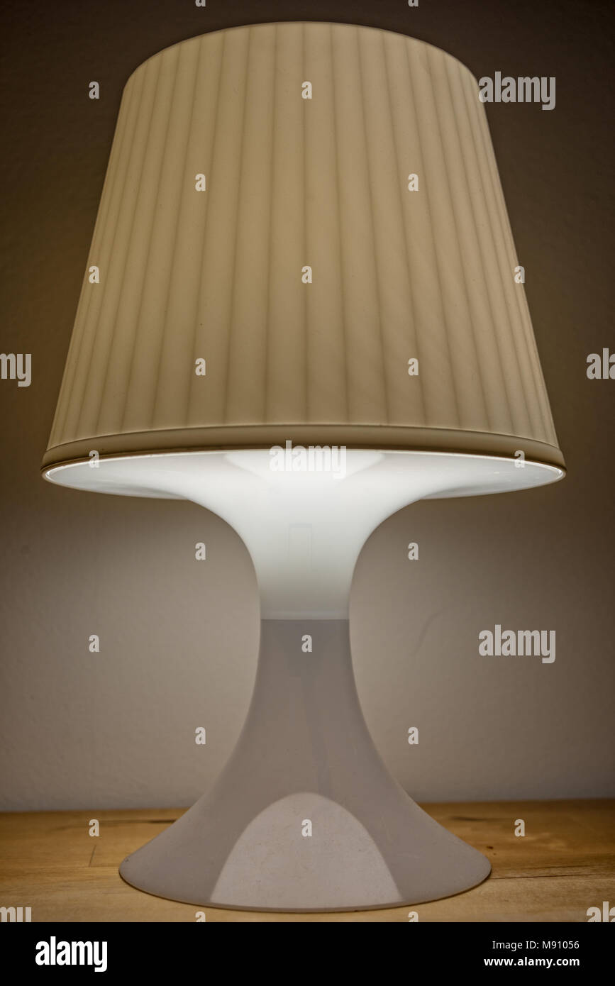 A Turn on bedside lamp is on the table Stock Photo - Alamy