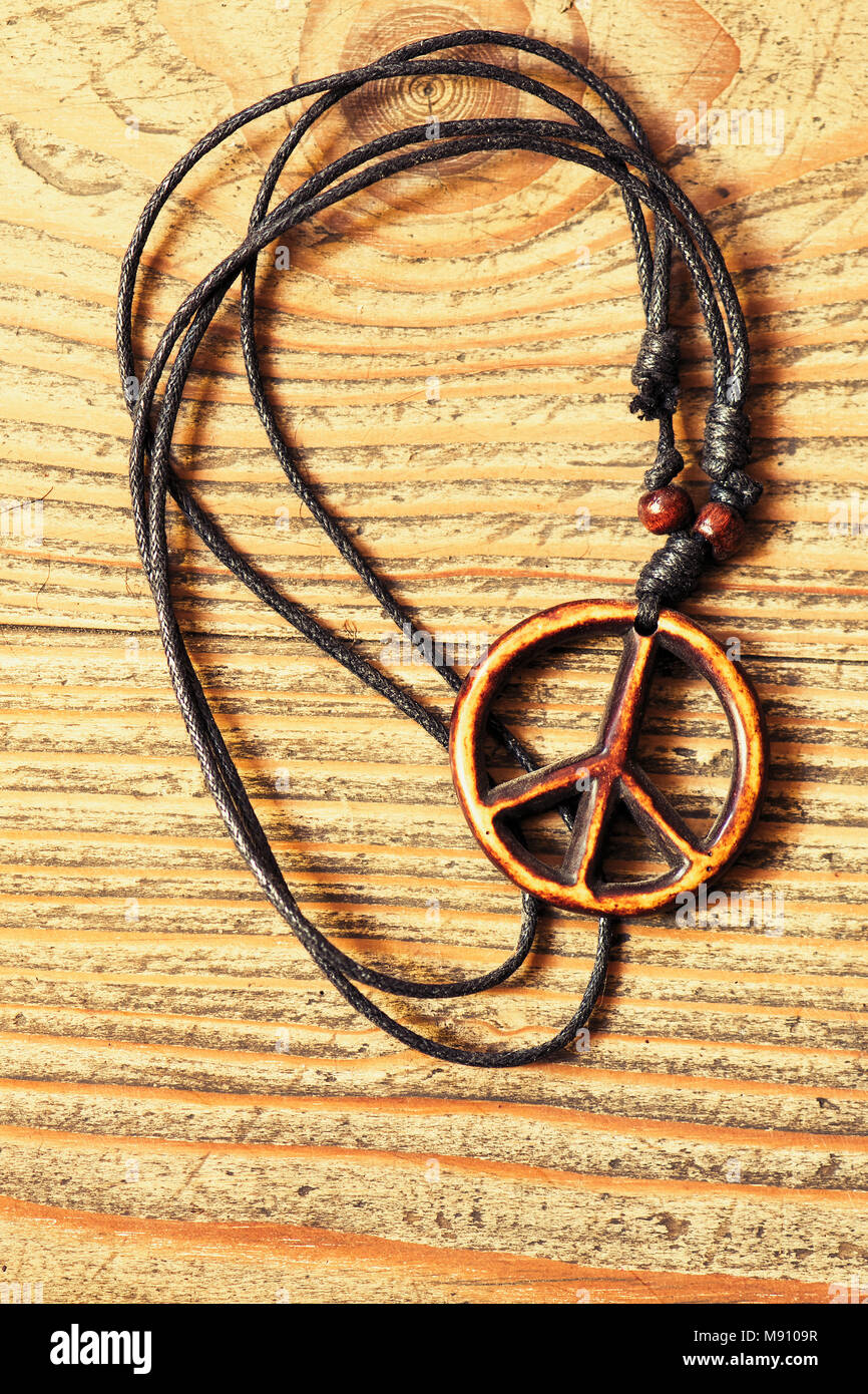 Wooden peace symbol on wooden background Stock Photo - Alamy
