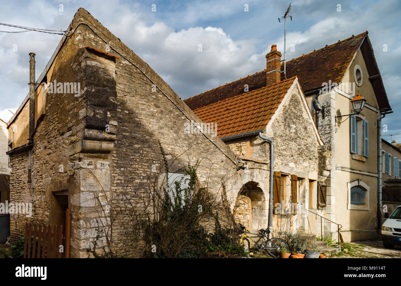 Old medieval houses on the cobbled street in ancient french village ...