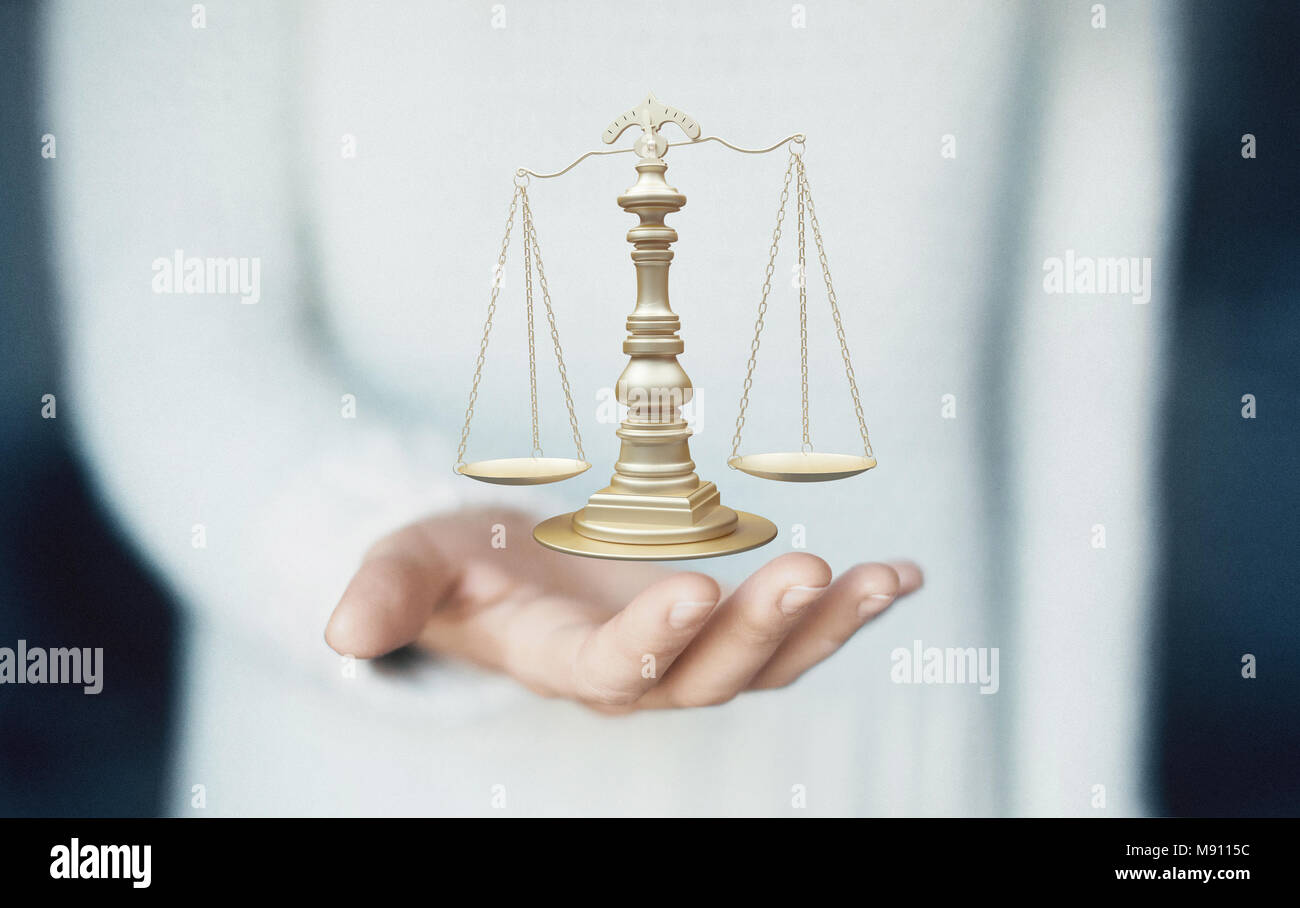 Scales of justice, weight of justice on hand, law Stock Photo - Alamy