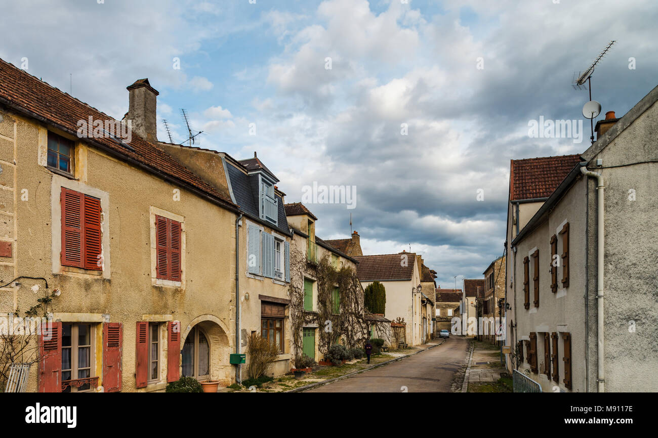 Old medieval houses on the cobbled street in ancient french village ...