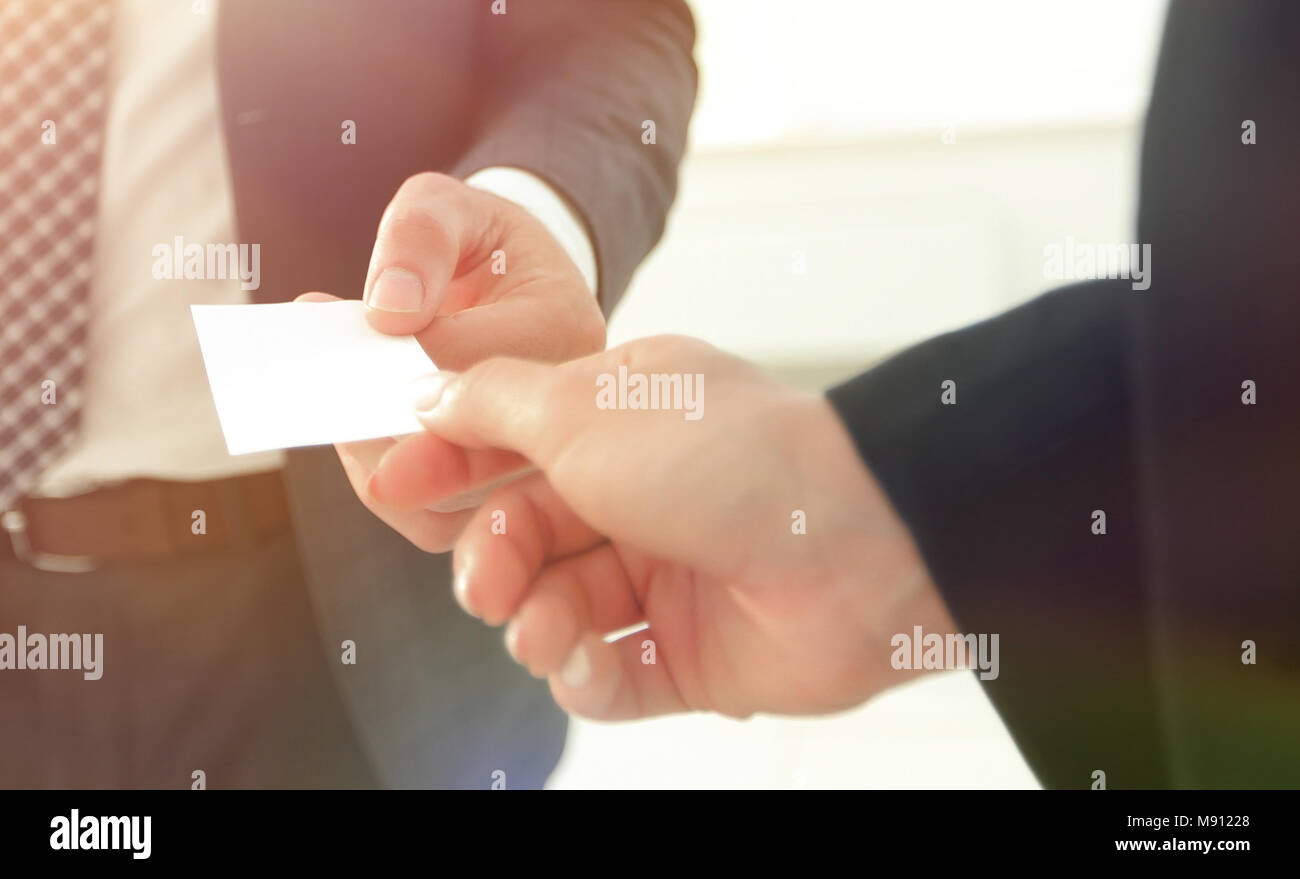 Exchange business card for first time meet Stock Photo - Alamy