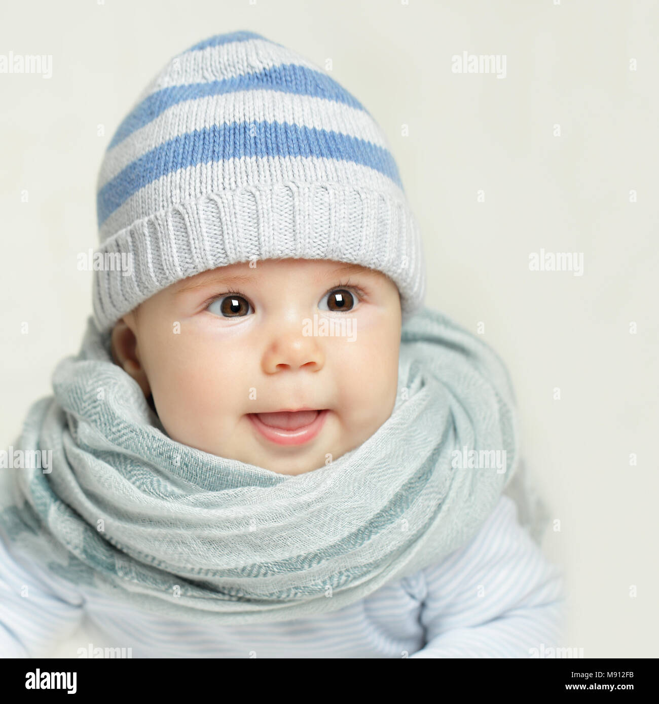 Laughing baby - adorable face, child in blue Stock Photo - Alamy