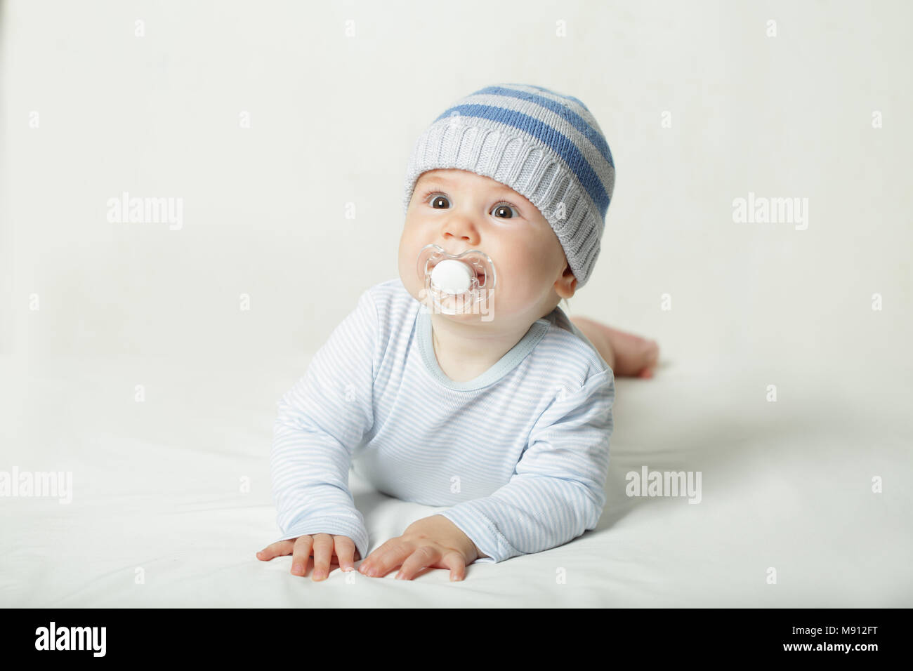 Girl sucking pacifier hi-res stock photography and images - Alamy