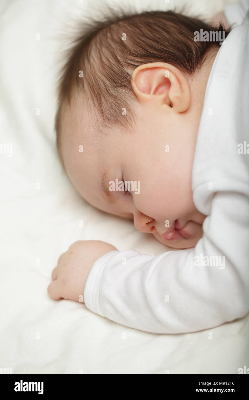 Small sleeping child on white background - bedtime Stock Photo - Alamy