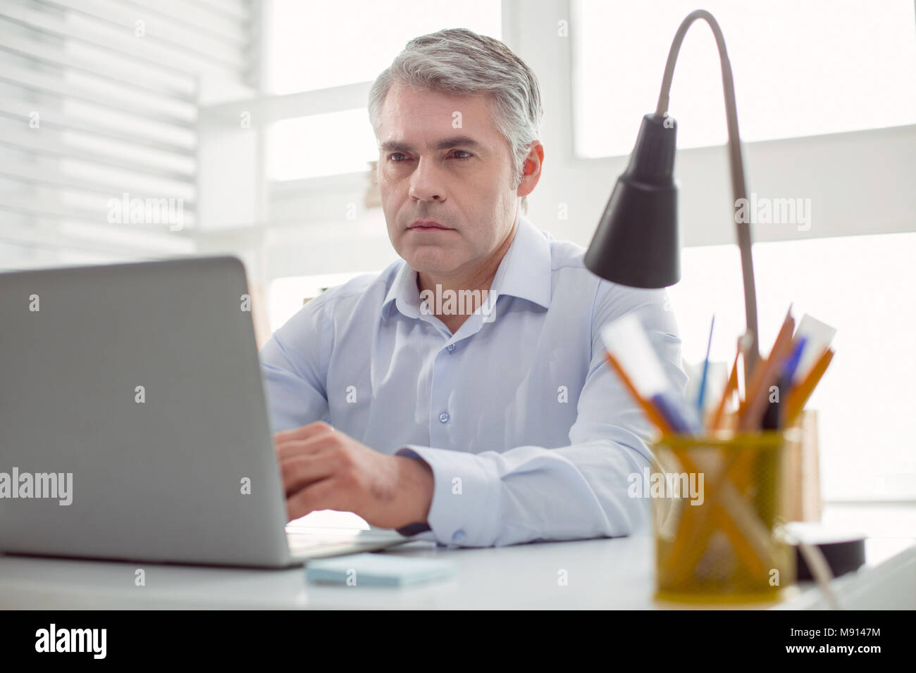 Smart confident man working Stock Photo - Alamy