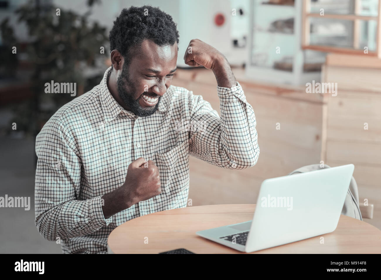 Joyful positive man expressing his emotions Stock Photo - Alamy