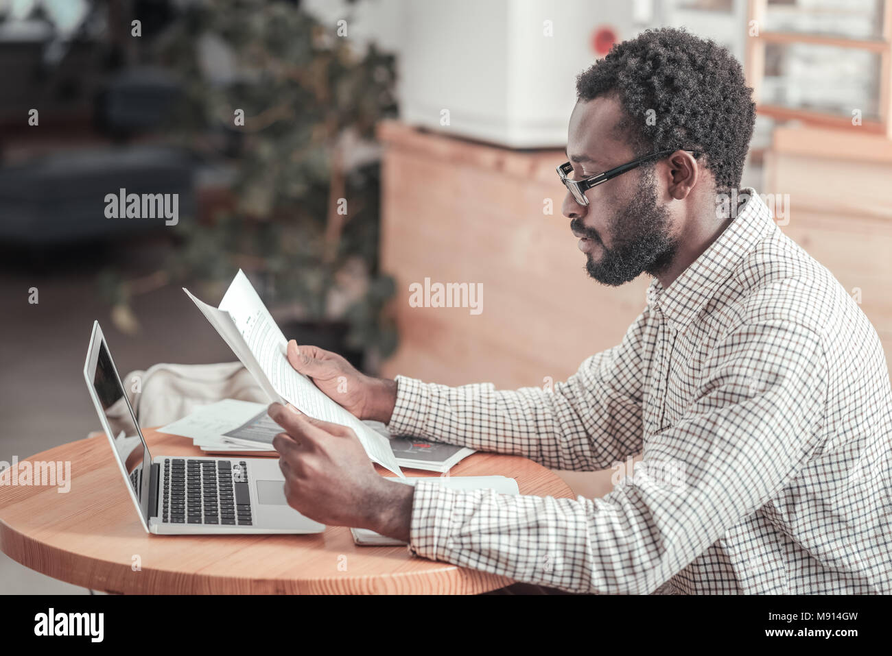 Ethnic student reading notes hi-res stock photography and images - Alamy