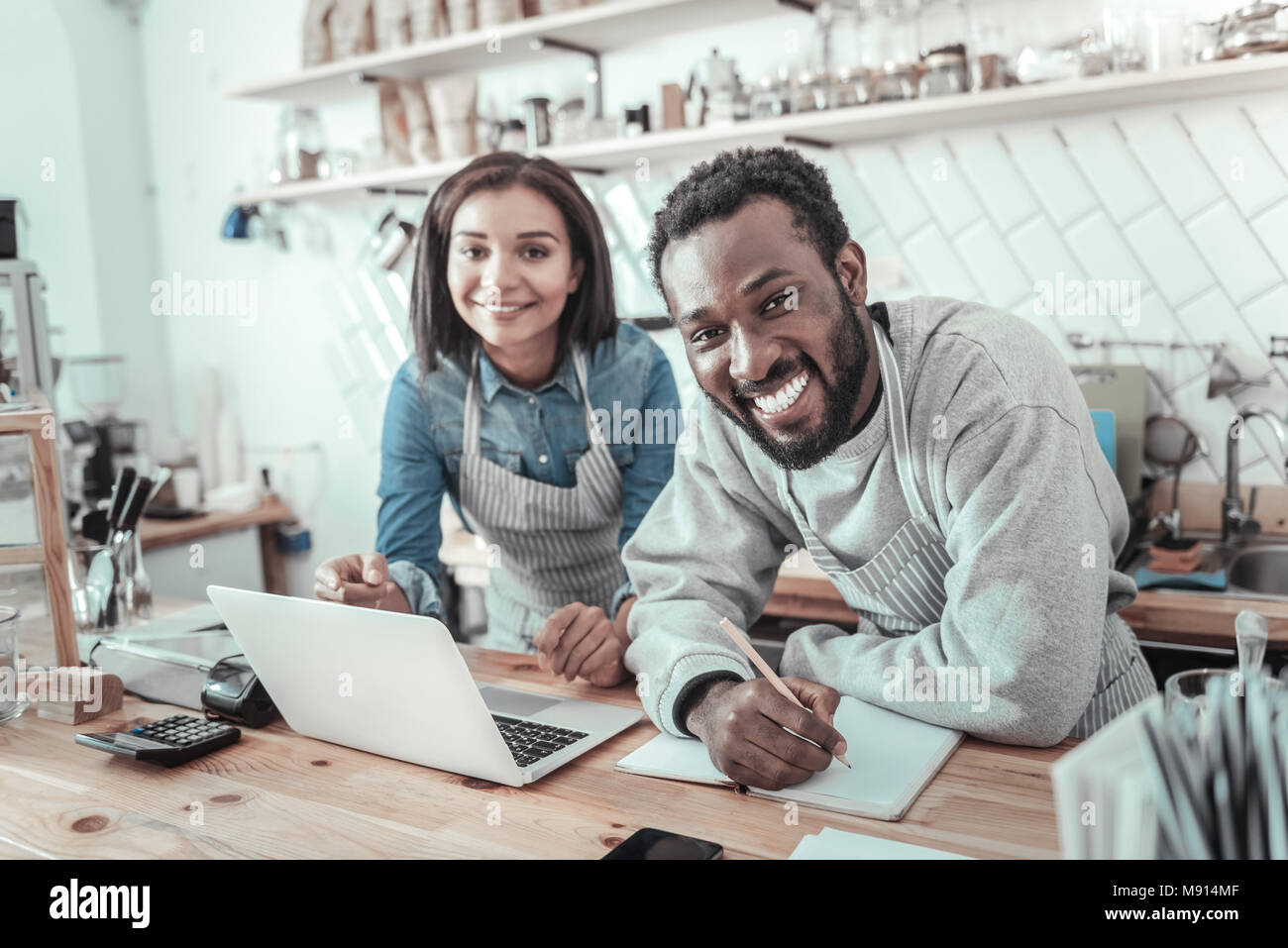 Happy positive man taking notes Stock Photo - Alamy