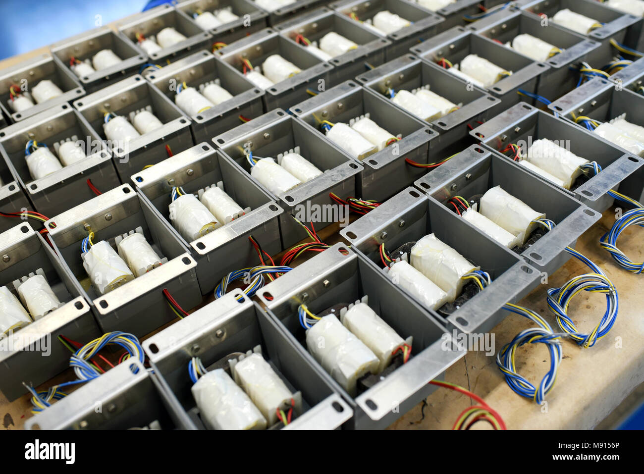 Rows of electric transformers in close up Stock Photo - Alamy