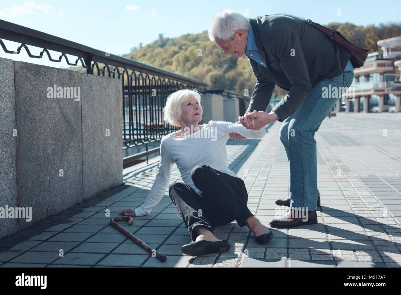 Stranger helping woman hi-res stock photography and images - Alamy