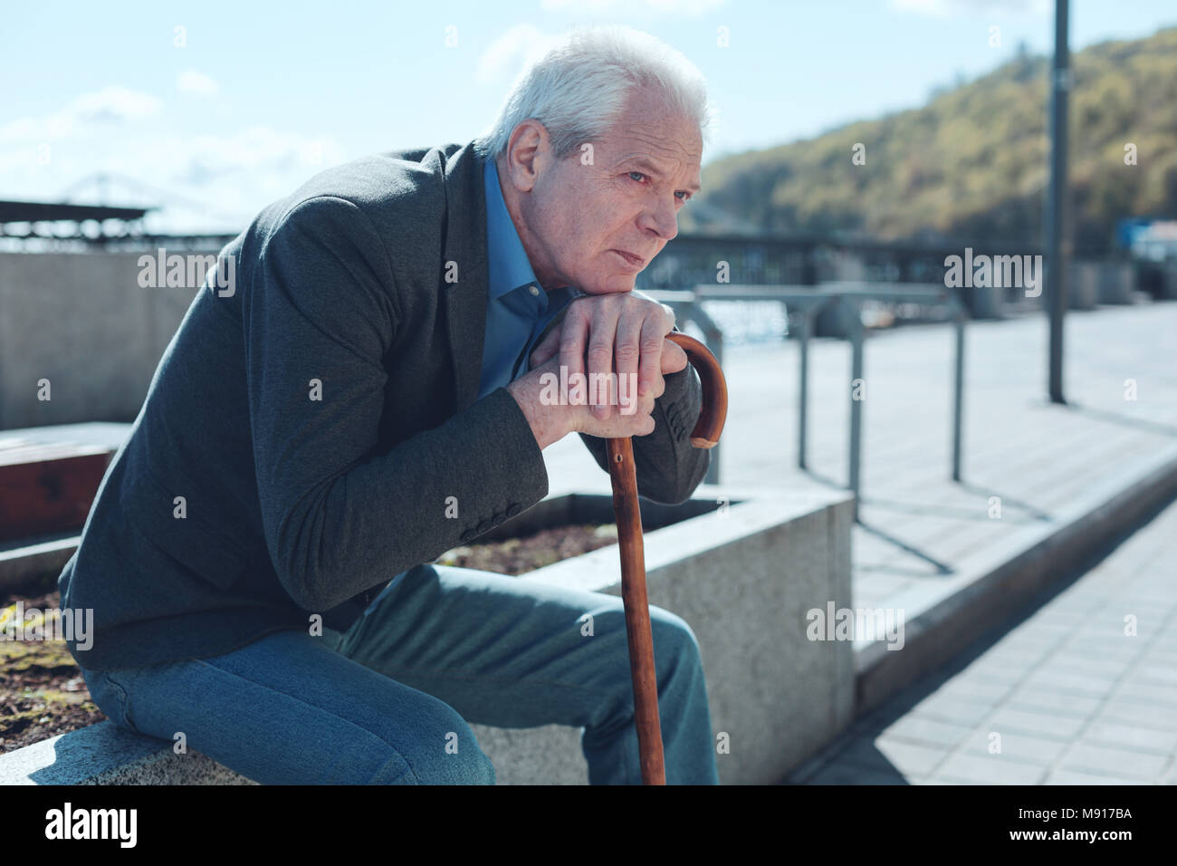 Side view on sad man with cane looking into vacancy Stock Photo - Alamy