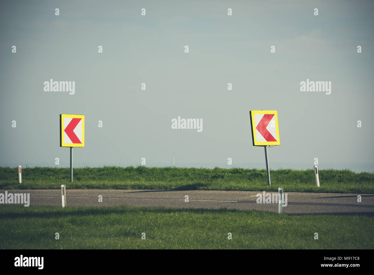 Road signs warning drivers about ahead dangerous curve Stock Photo - Alamy