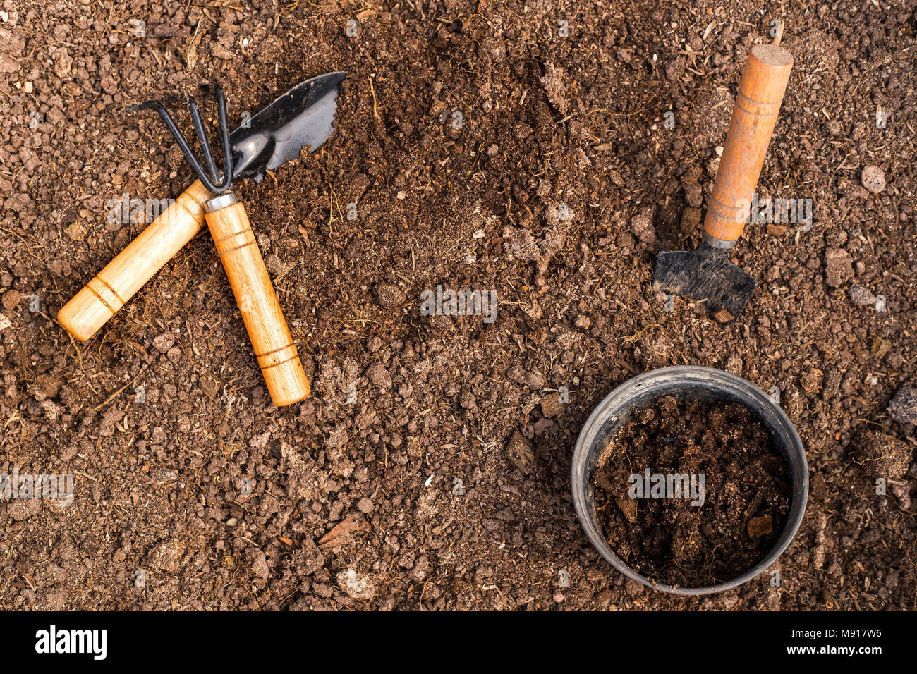 Gardening tools and soil for planting Stock Photo - Alamy