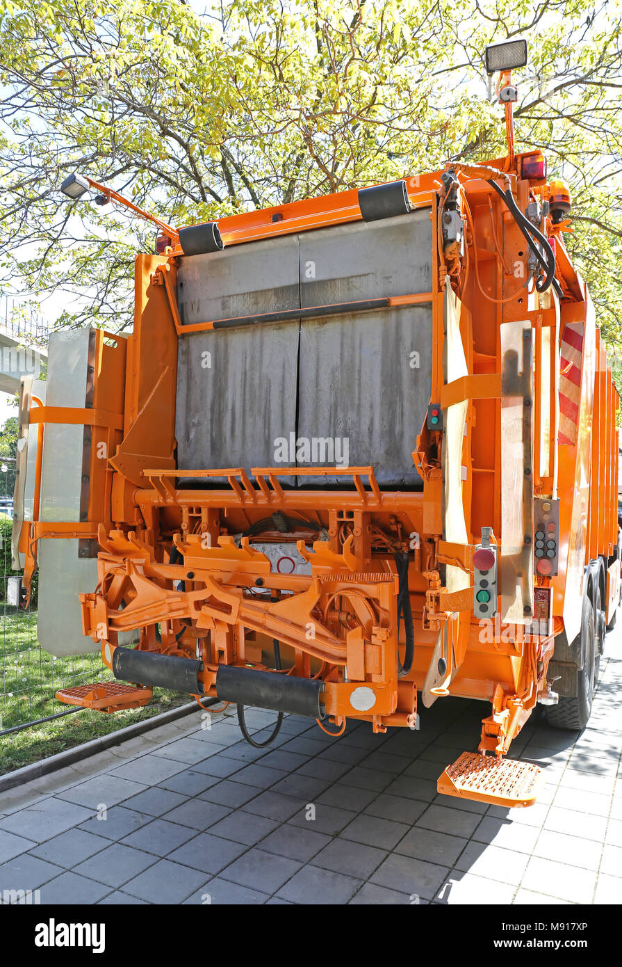 Waste Collection Loader at Rear of Big Garbage Truck Stock Photo - Alamy