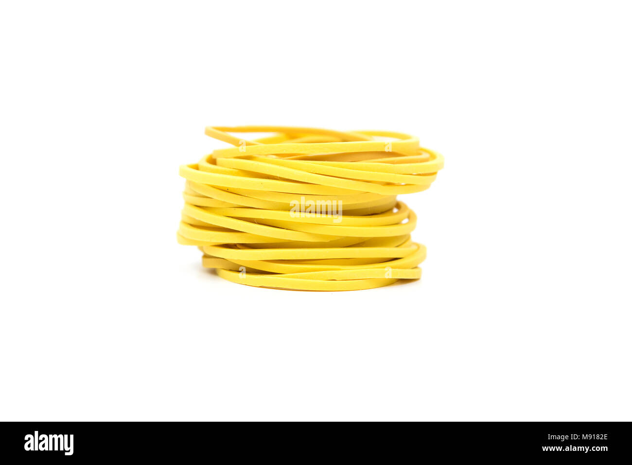 Pile of yellow rubber bands isolated on white background. Packaging ...