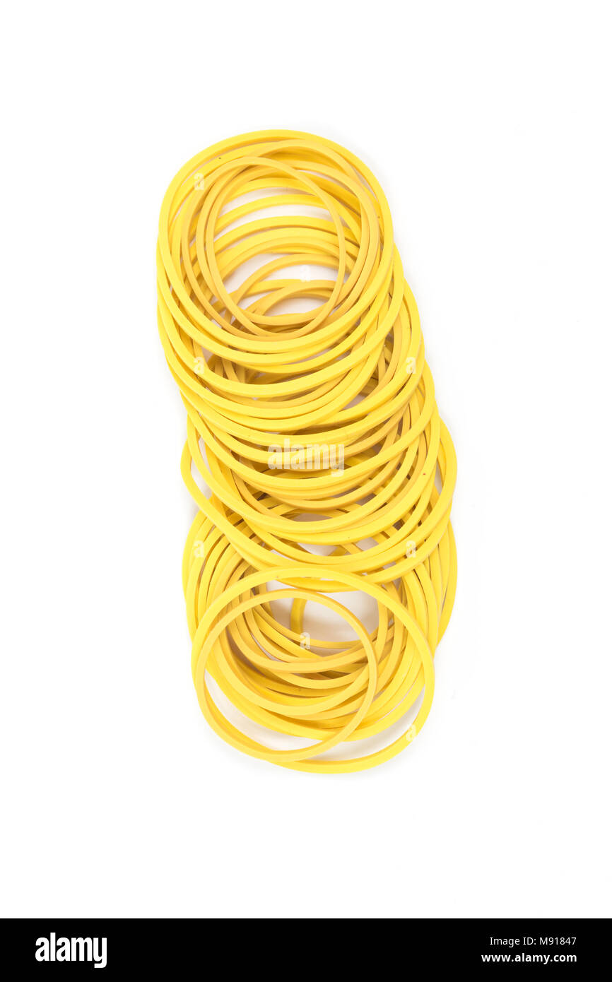 Pile of yellow rubber bands isolated on white background. Packaging ...