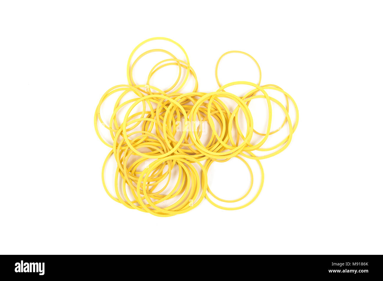 Pile of yellow rubber bands isolated on white background. Packaging ...