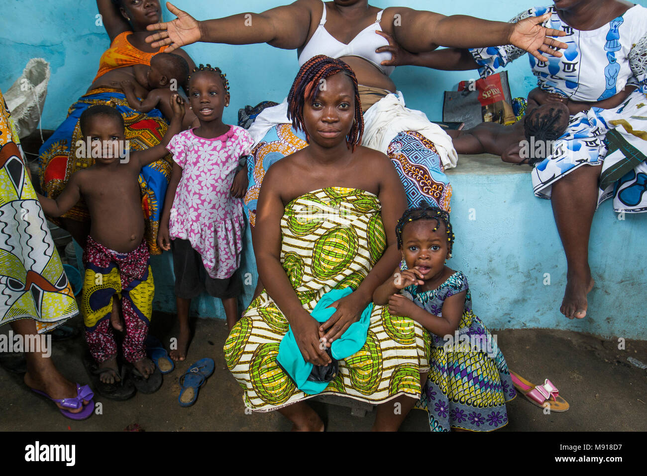 Woman and children in a voodoo shrine in Cotonou, Benin Stock Photo - Alamy