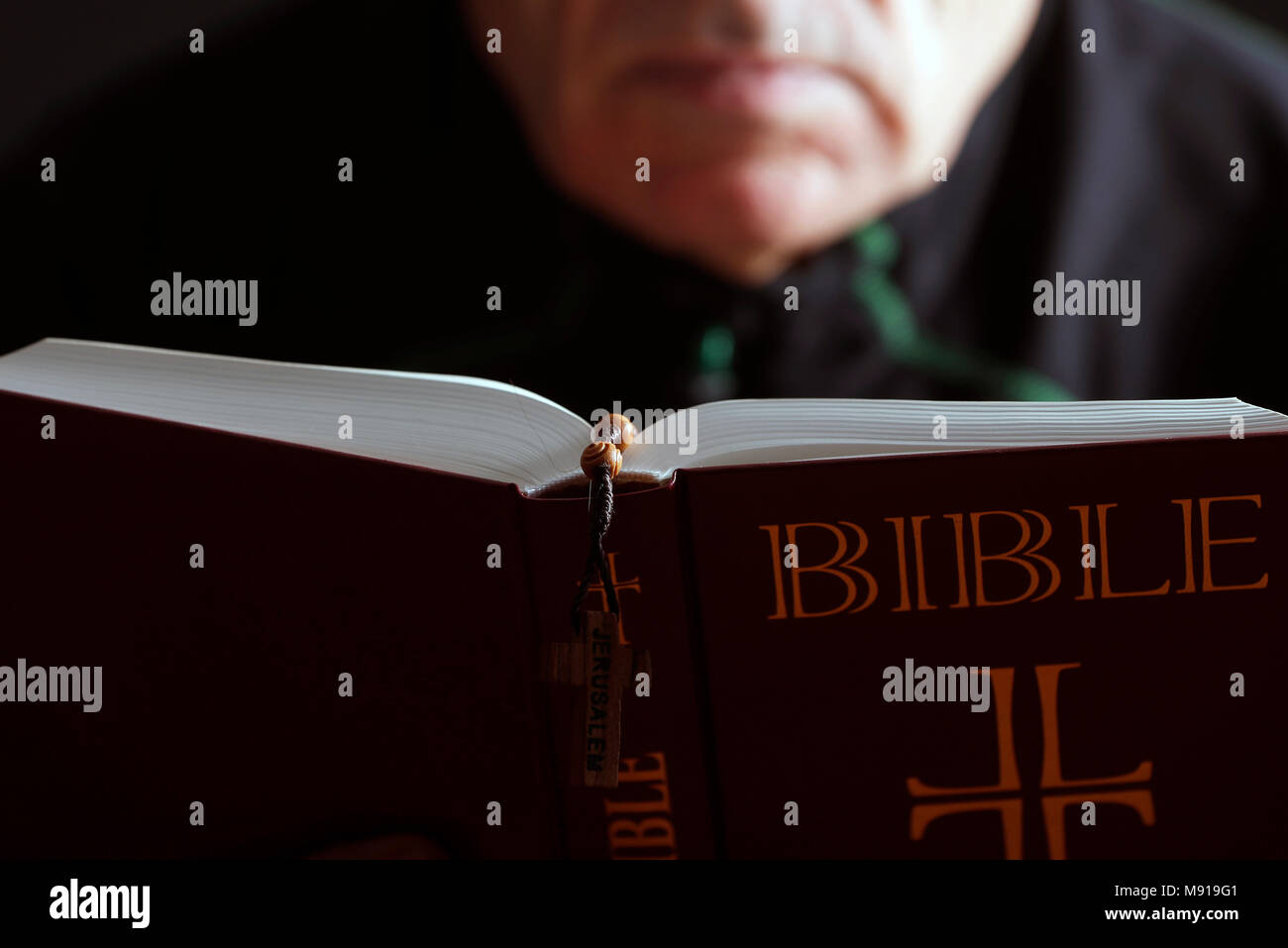 Man reading holy bible hi-res stock photography and images - Alamy