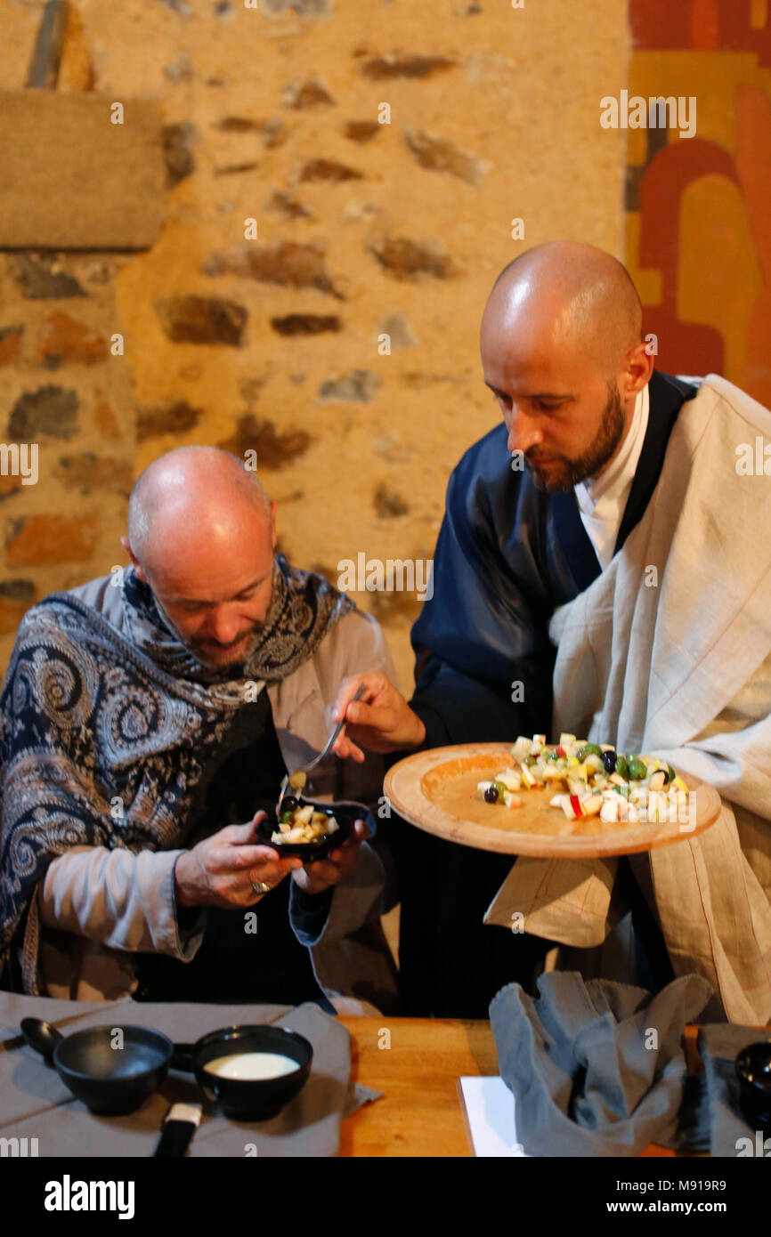 Zen sesshin (retreat). Master serving meal to a disciple. France Stock ...