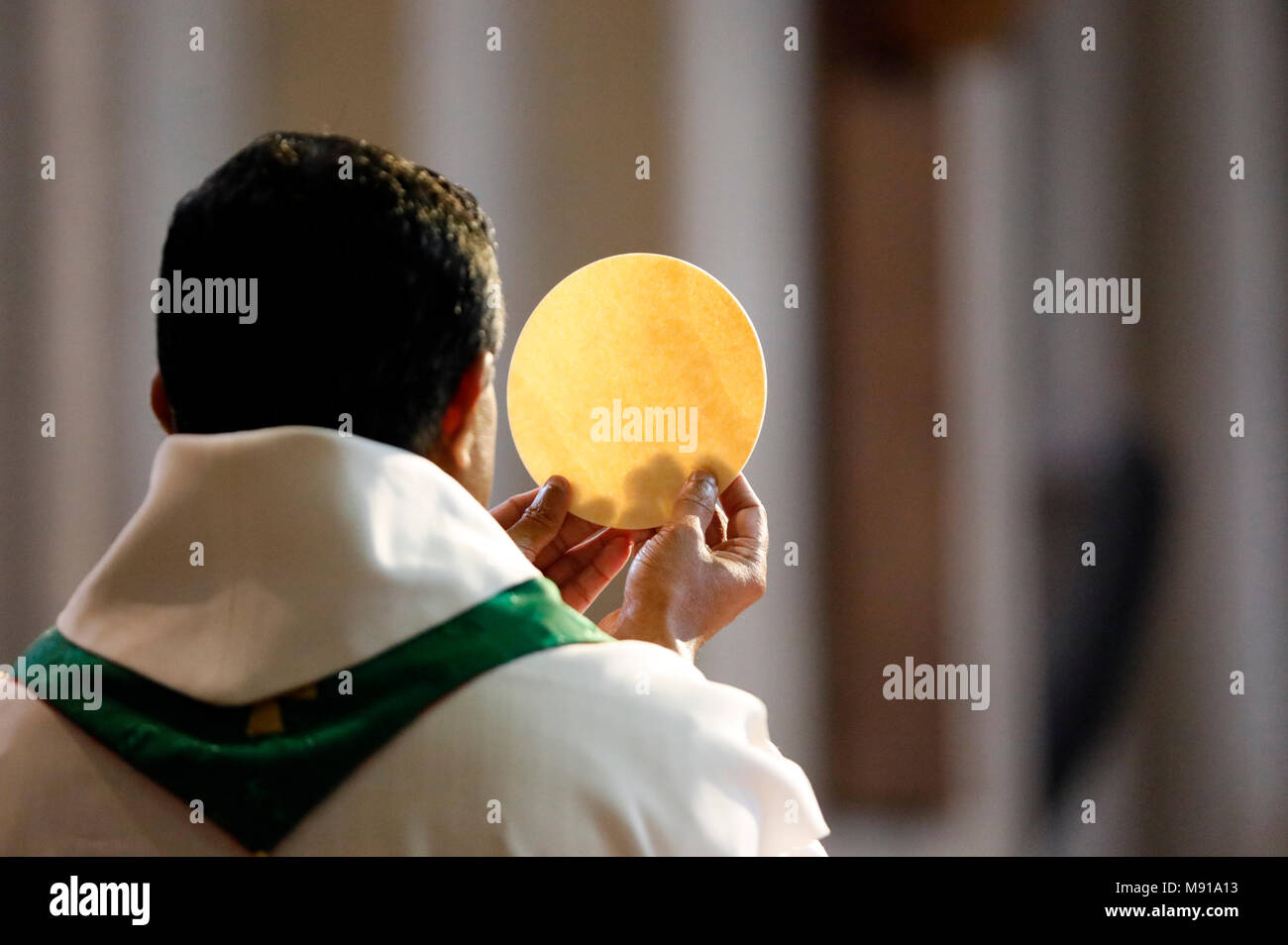Saint-Jacques church. Sunday morning catholic mass. Eucharistic ...