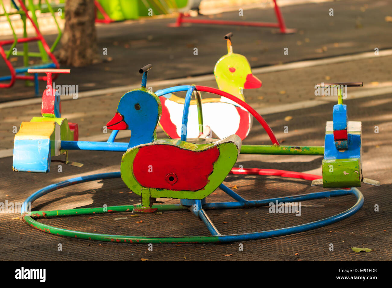 Duck toy on the playground Stock Photo - Alamy