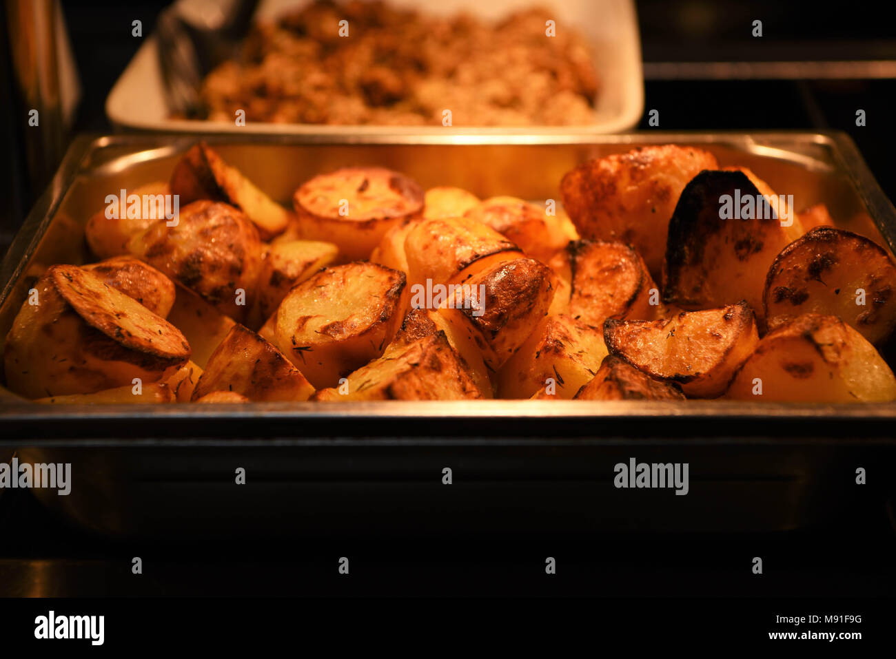golden crispy roast potatoes for a roast dinner Stock Photo - Alamy