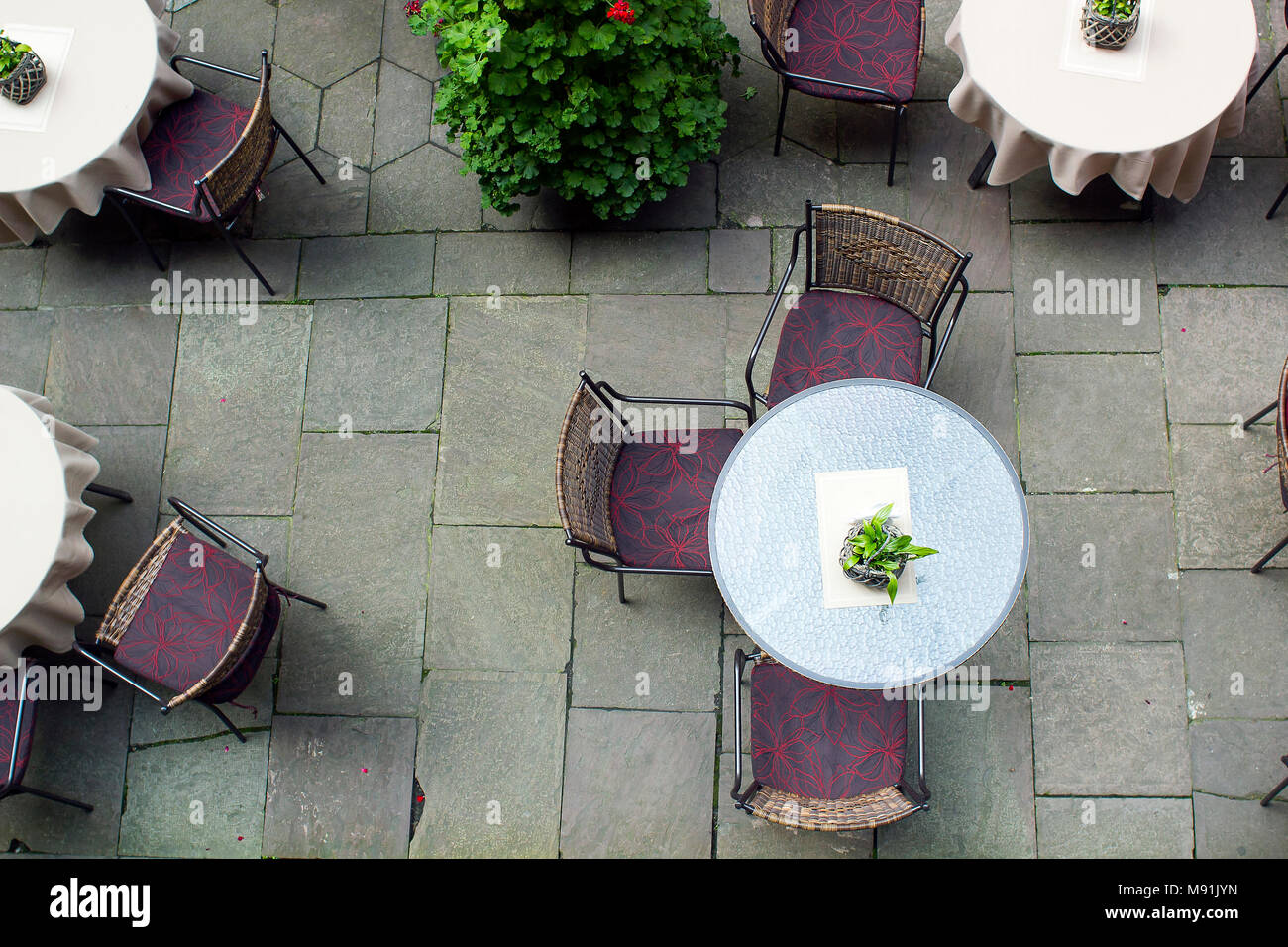 Tables and chairs on terrace, top view. Yard furniture, view above ...