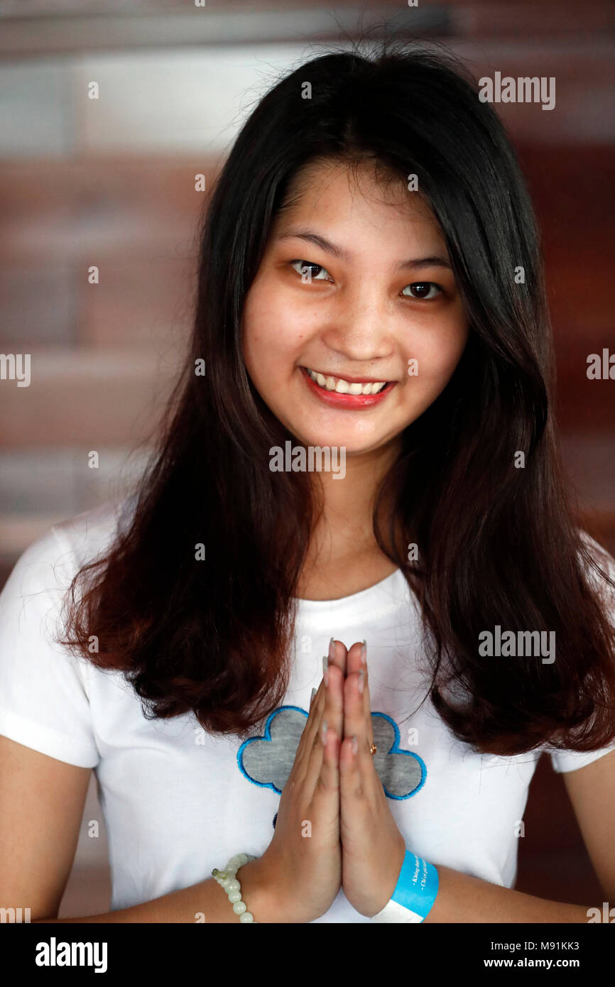 Minh Dang Quang buddhist temple. Woman praying at Buddhist service. Ho ...