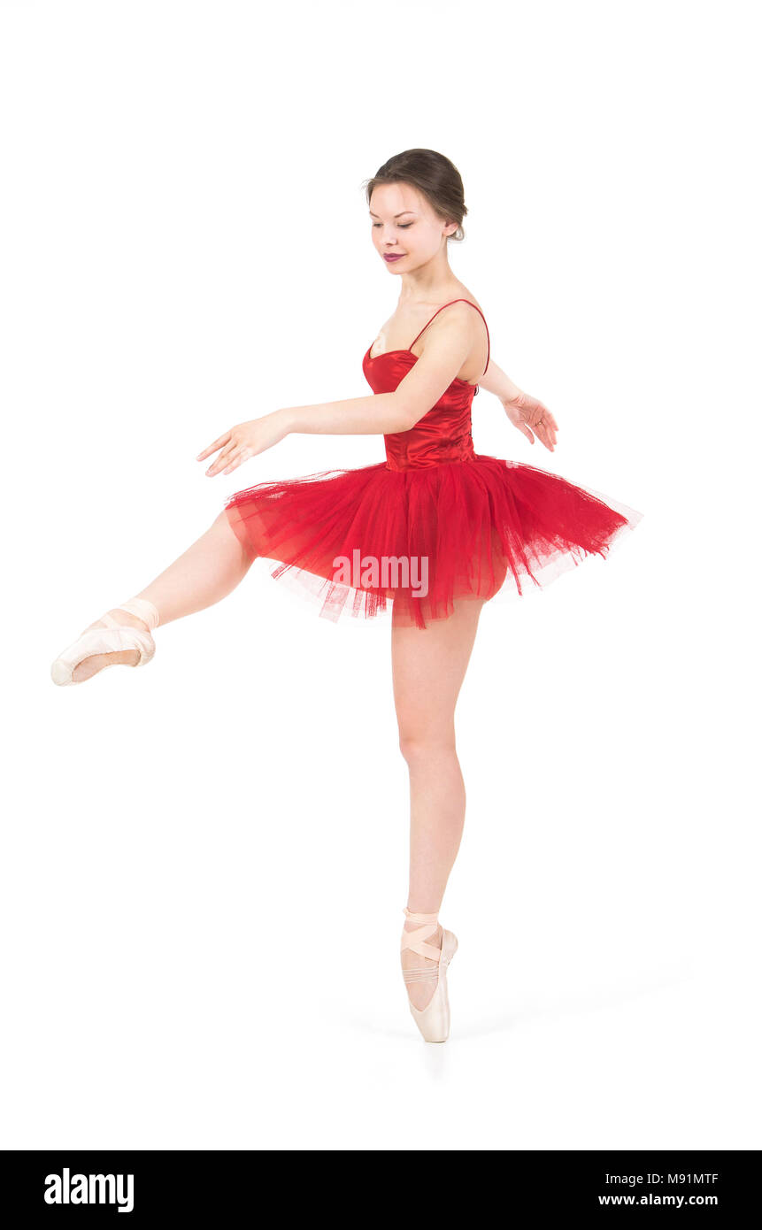 A woman in a red tutu dancing ballet. Studio shot on white background ...