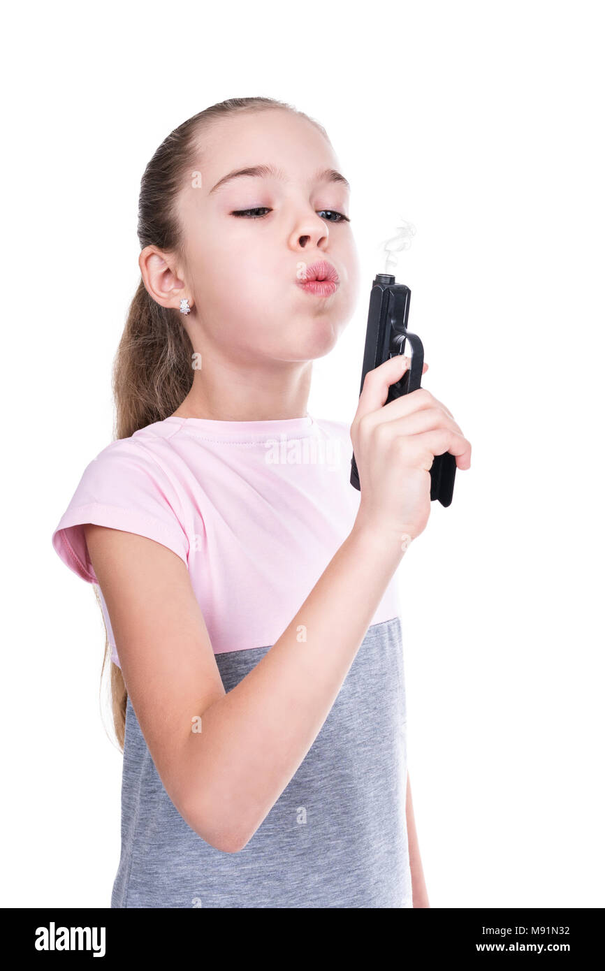 Young girl blowing on gun barrel, blowing smoke, close-up, isolated on ...