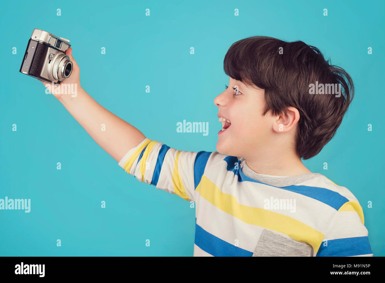 Smiling child taking selfie photo Stock Photo - Alamy