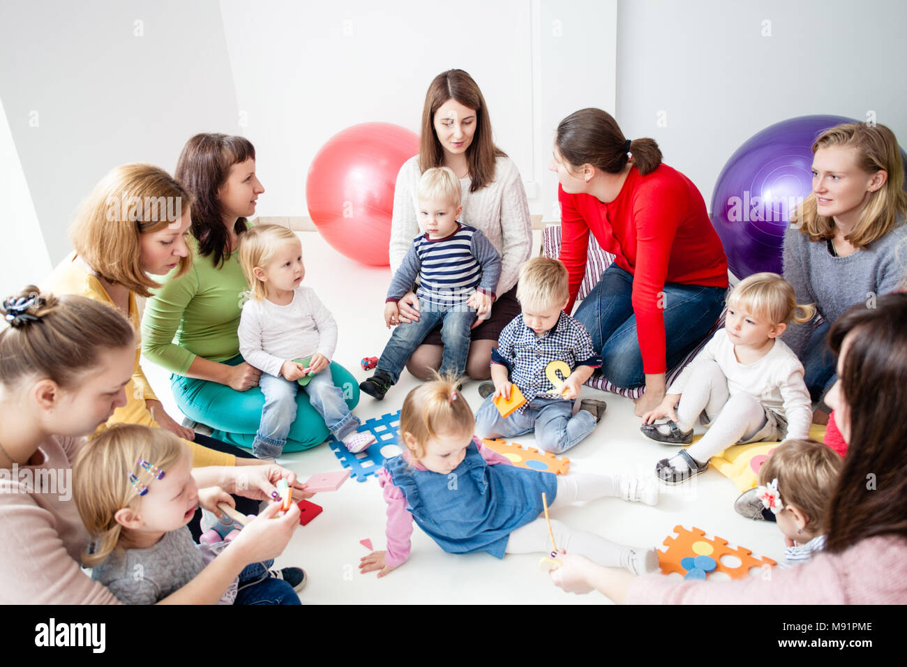 Young moms with their kids Stock Photo - Alamy