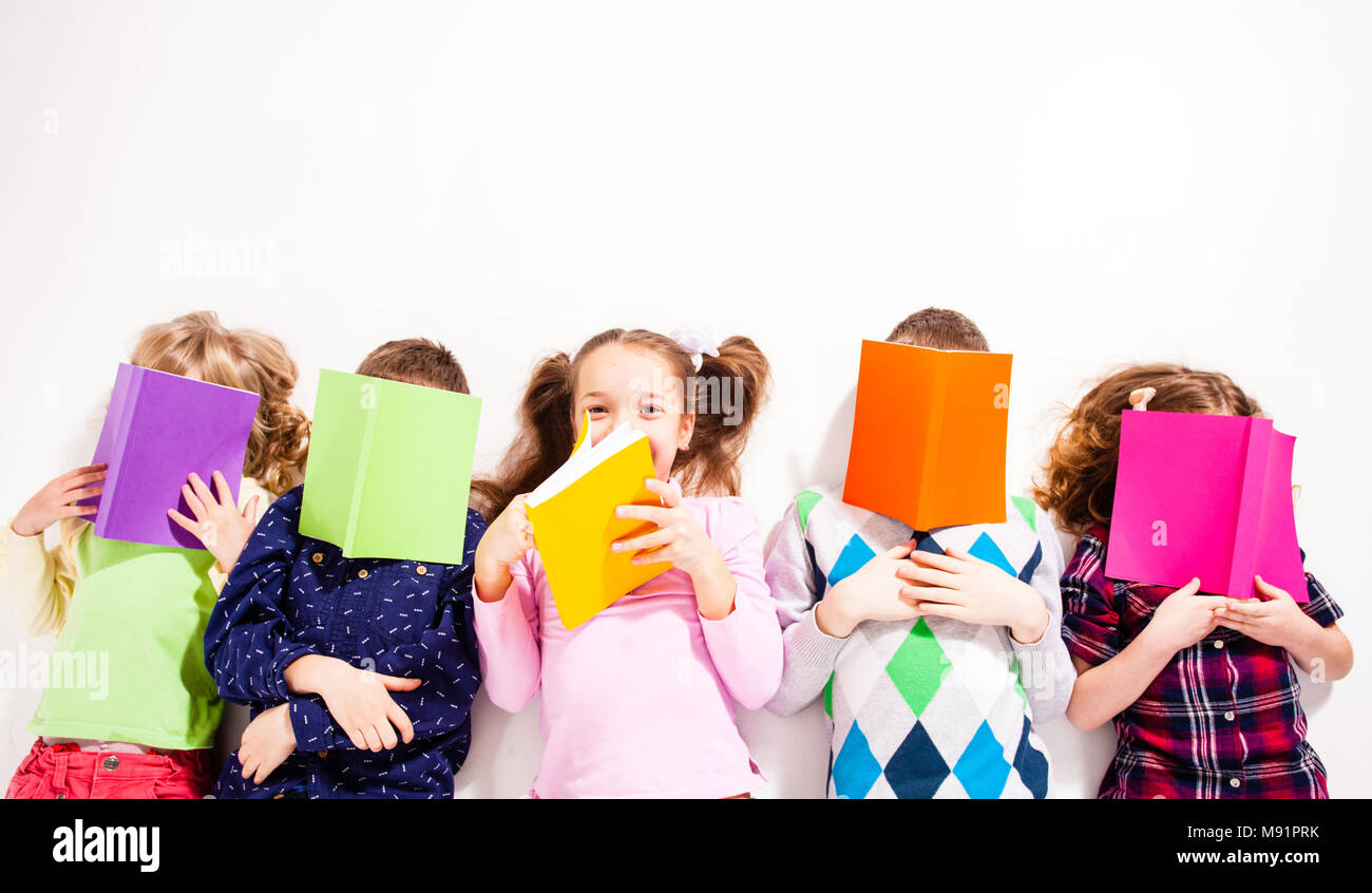 The cute children with books Stock Photo - Alamy