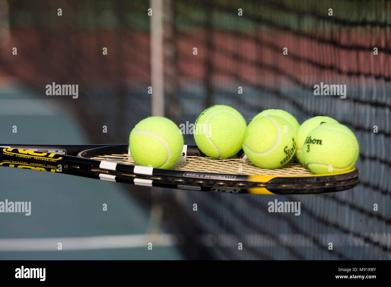 Tennis racket and balls Stock Photo - Alamy