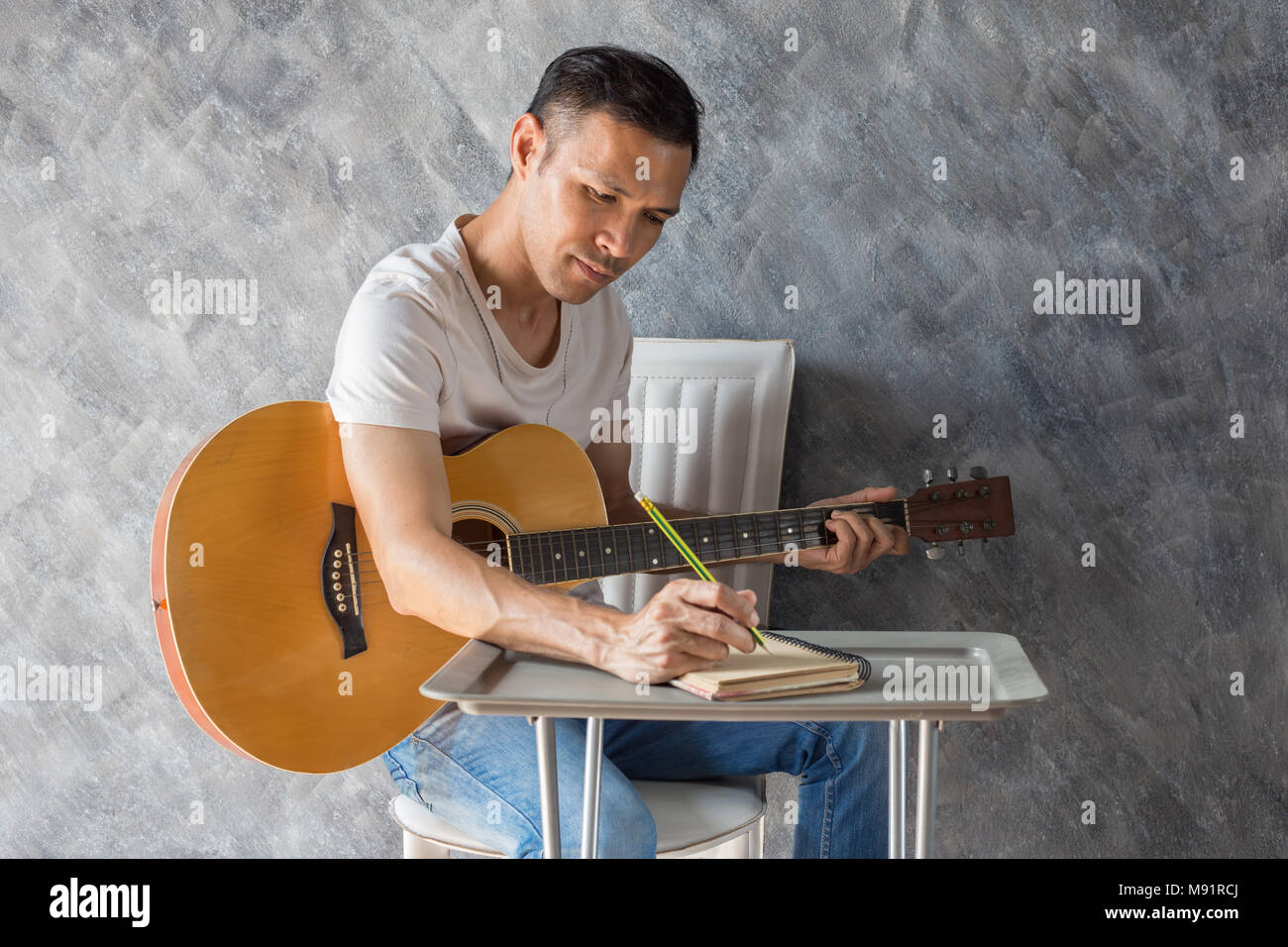 Young man musician composing melody hi-res stock photography and images ...