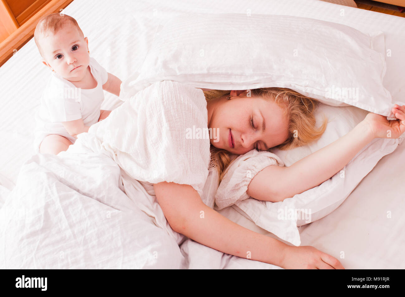 Baby Wake Up Sleepy Mom Stock Photo Alamy