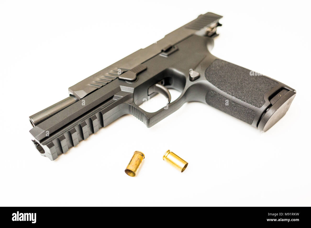 Unloaded handgun with ammo rounds on isolated background Stock Photo ...