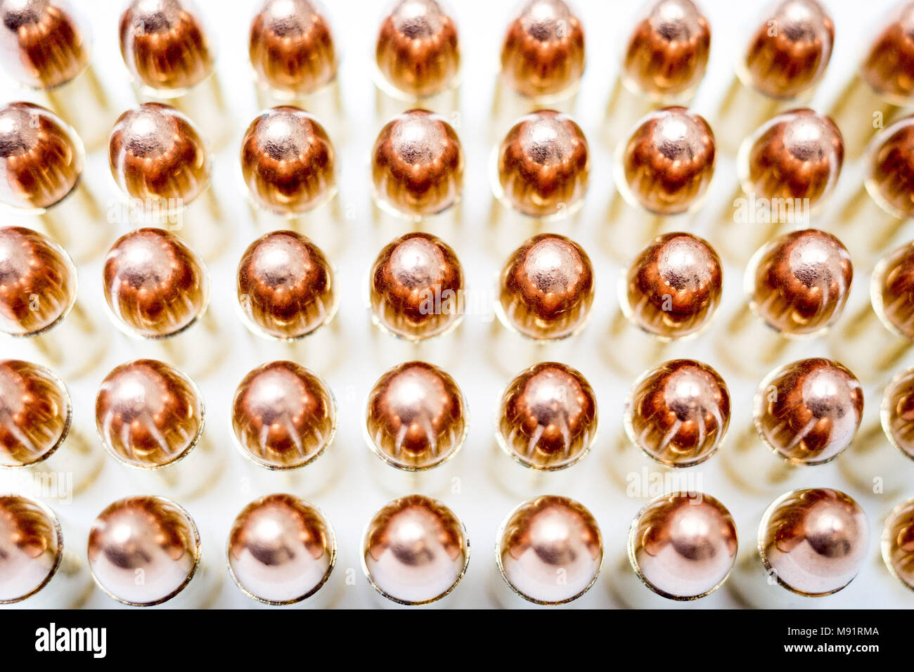 handgun ammo rounds close up bronze on white background Stock Photo - Alamy