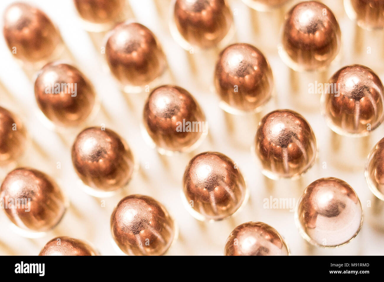 handgun ammo rounds close up bronze on white background Stock Photo - Alamy