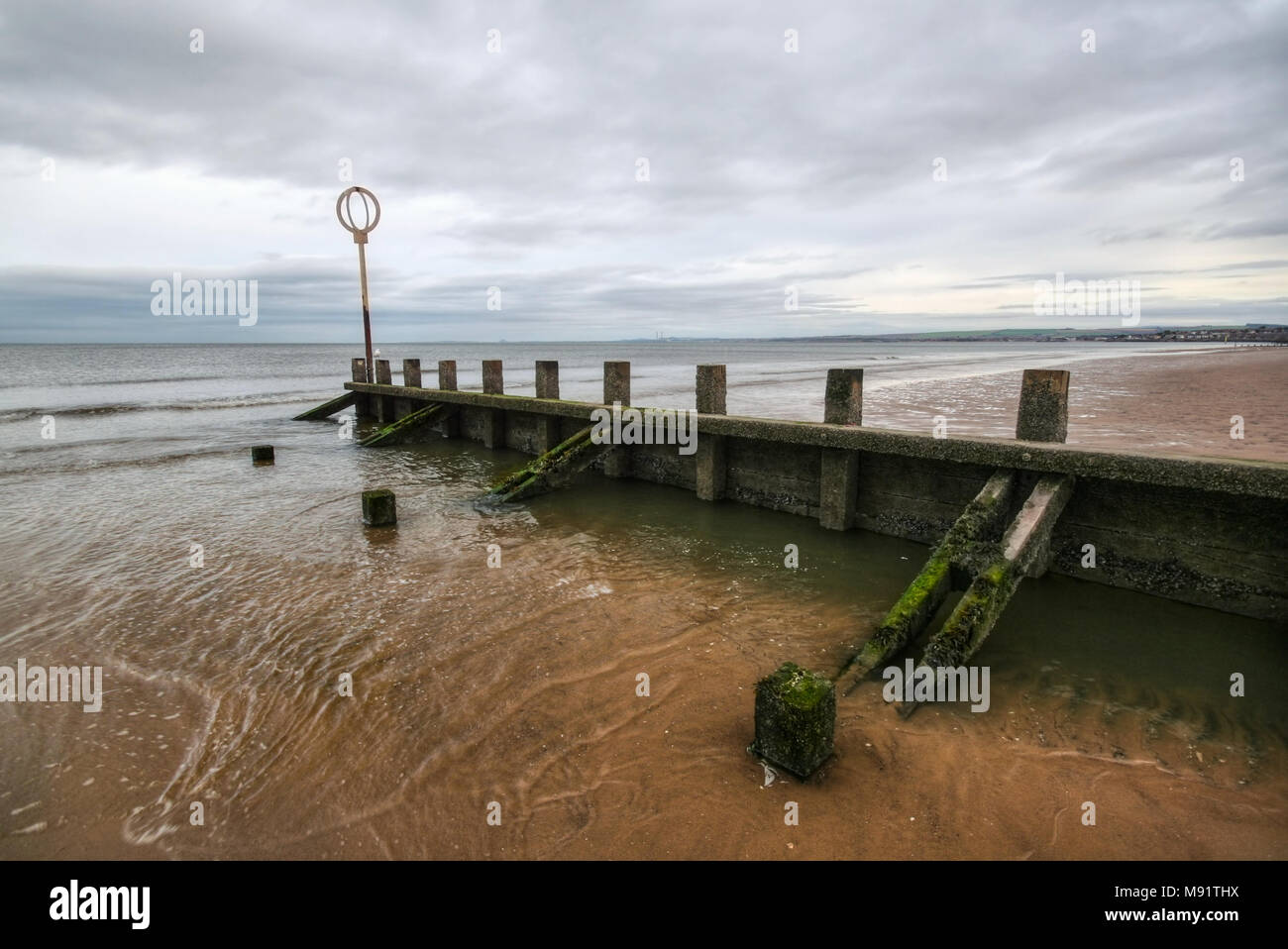 Old timber sea groynes hi-res stock photography and images - Alamy